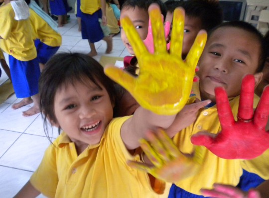 Early childcare for young girls in Cebu City slums, Philippines